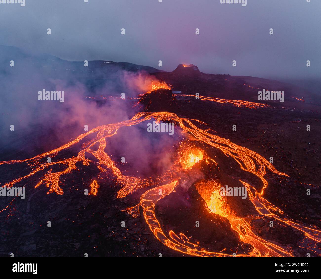 Aerial View of craters and lava during volcanic eruption at ...