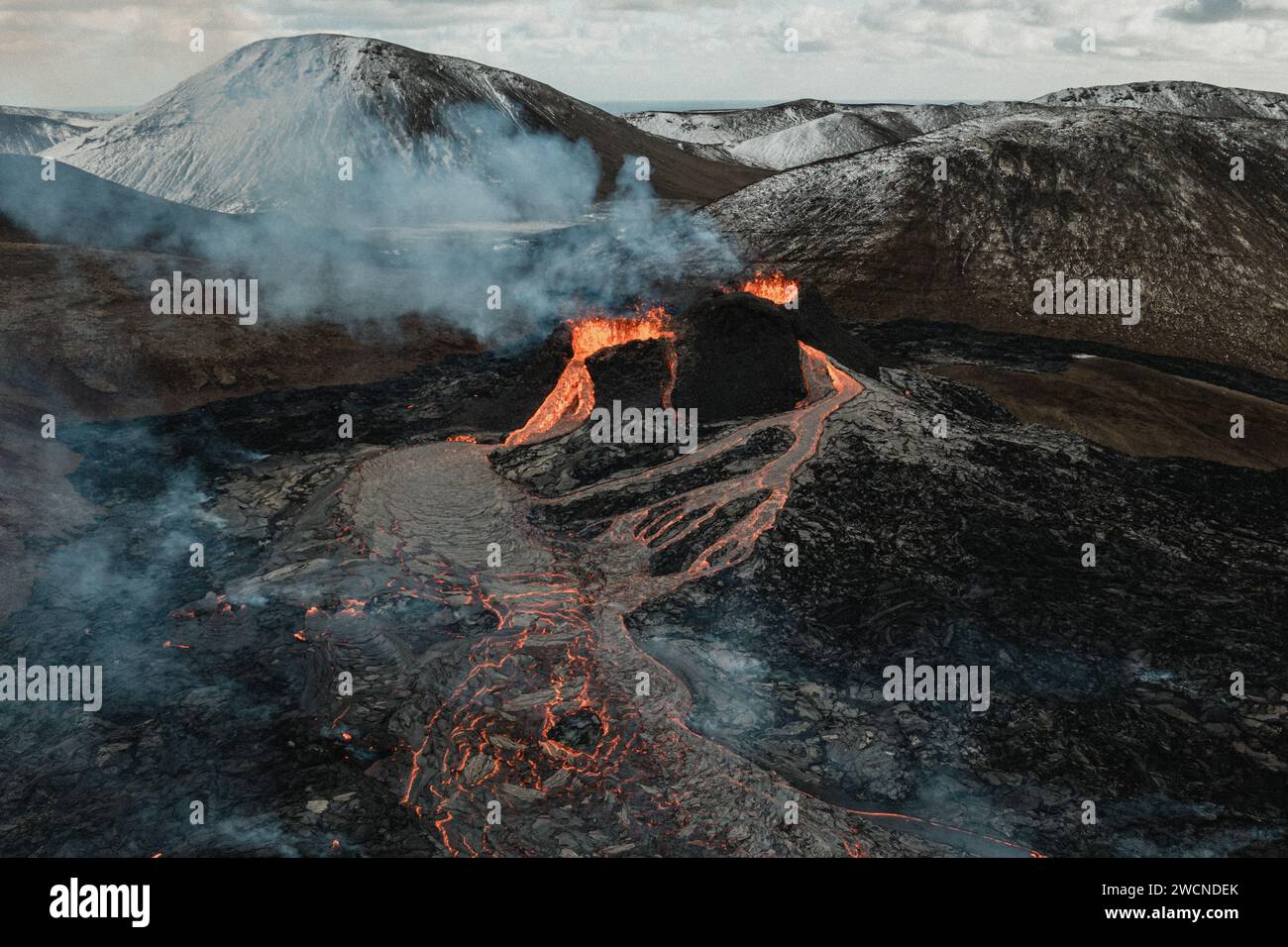Aerial View of craters during volcanic eruption at Fagradallsfjall ...