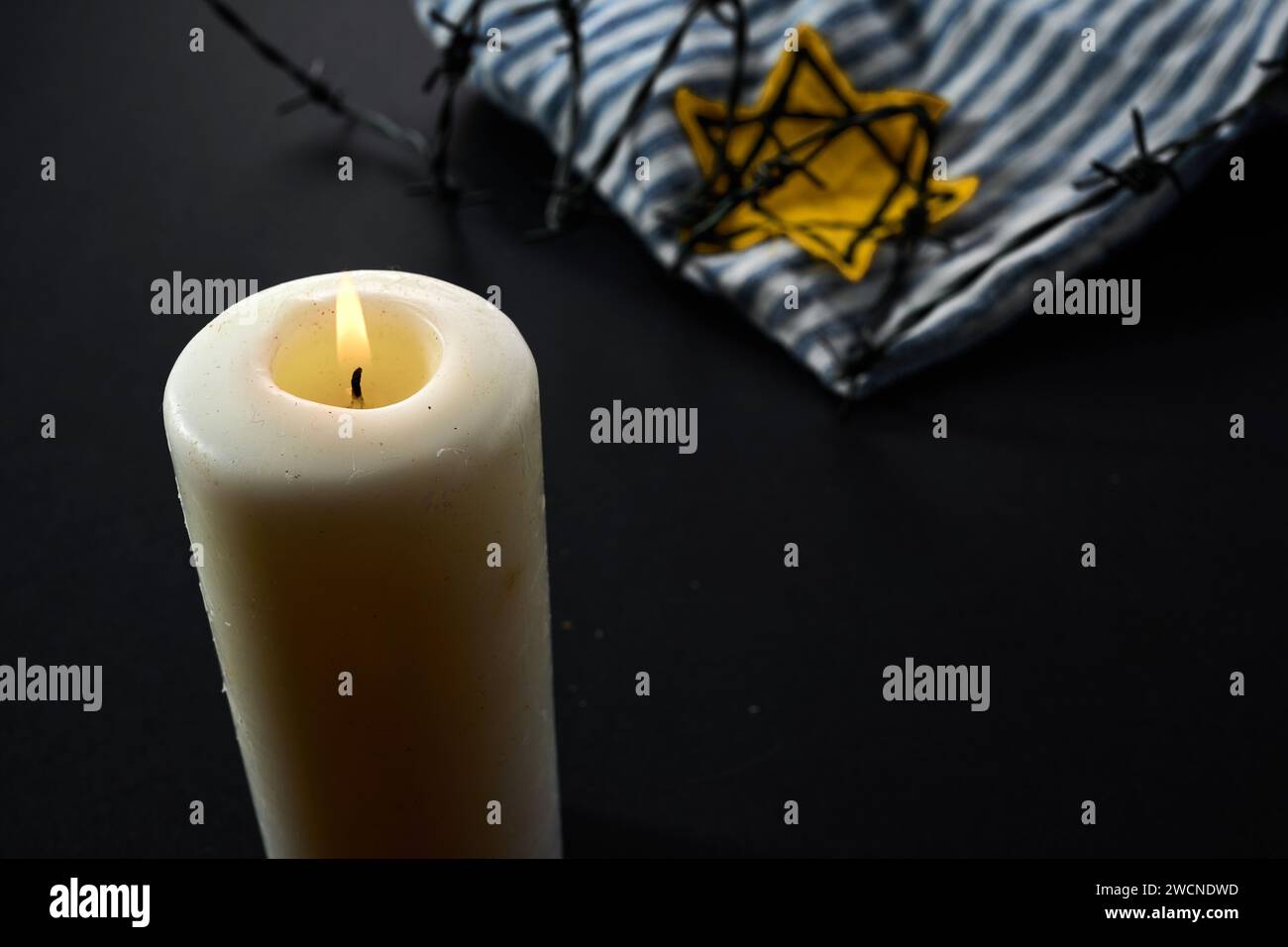 Jewish prisoner with yellow badge on dark background. International ...