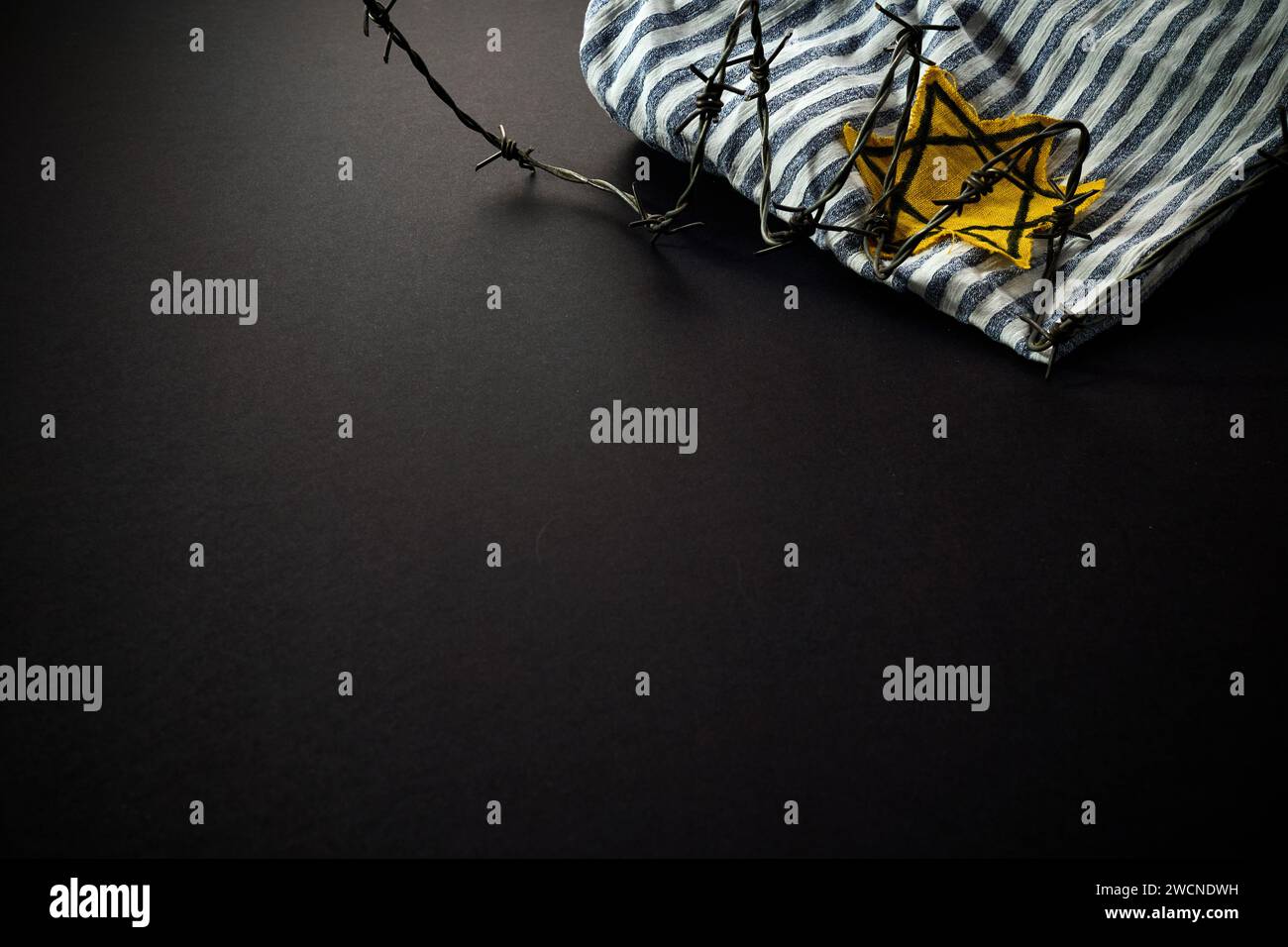 Jewish prisoner with yellow badge on dark background. International ...