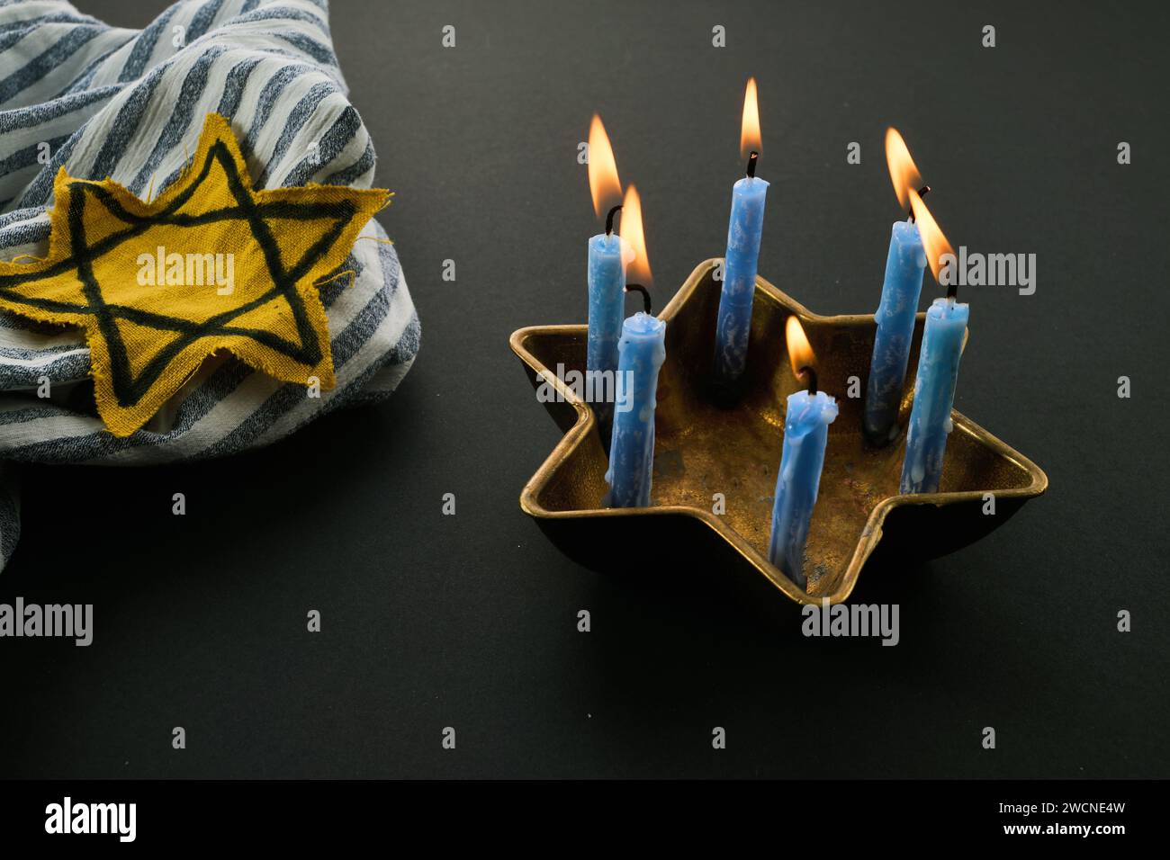 Jewish prisoner with yellow badge on dark background. International ...