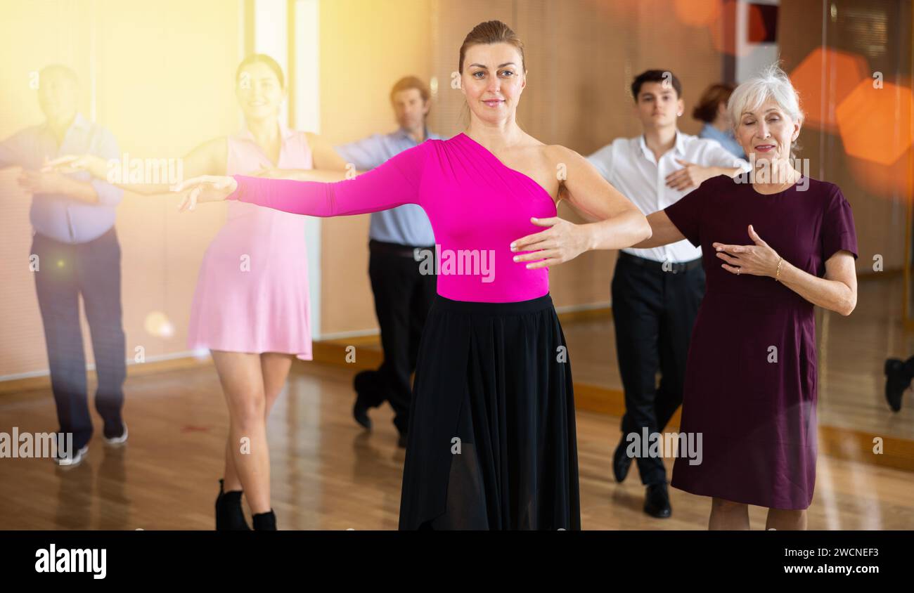 Woman practicing slow foxtrot movements during dance class Stock Photo ...