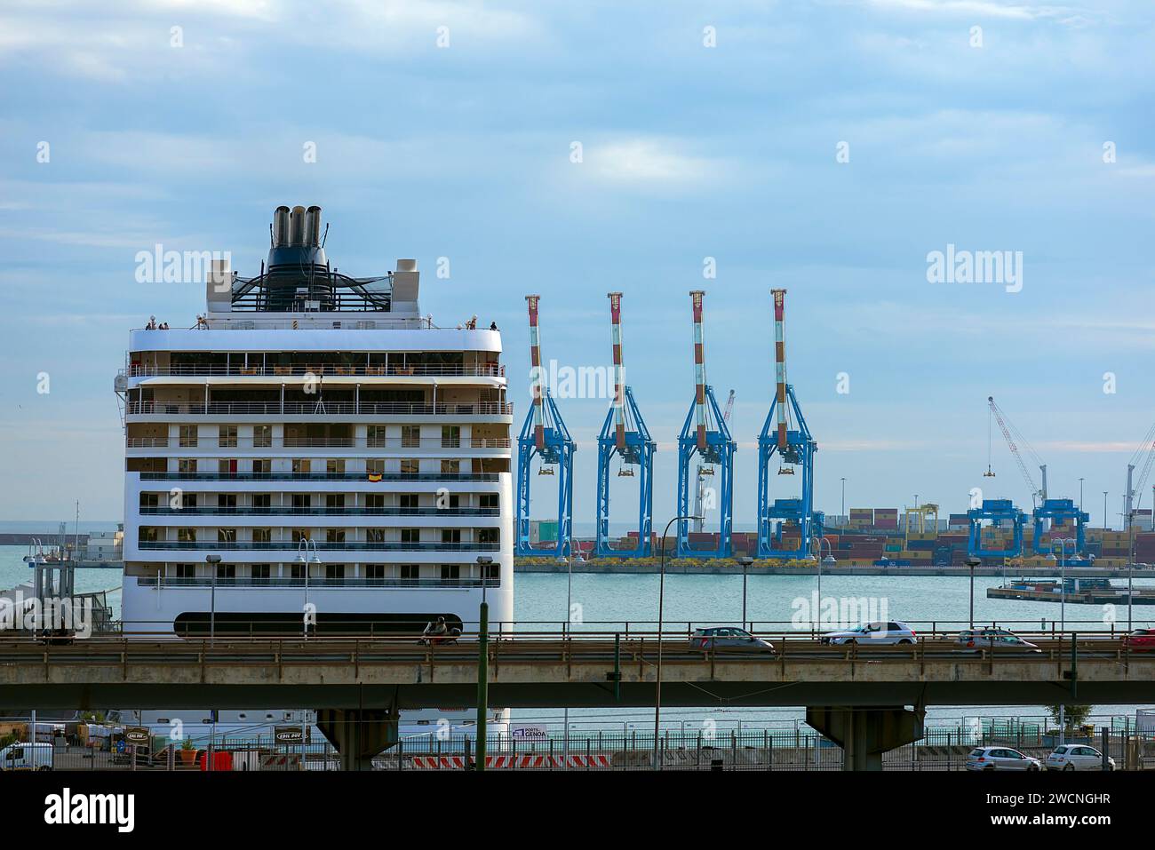 Cruise ship in harbour, unloading cranes behind, Genoa, Italy Stock ...