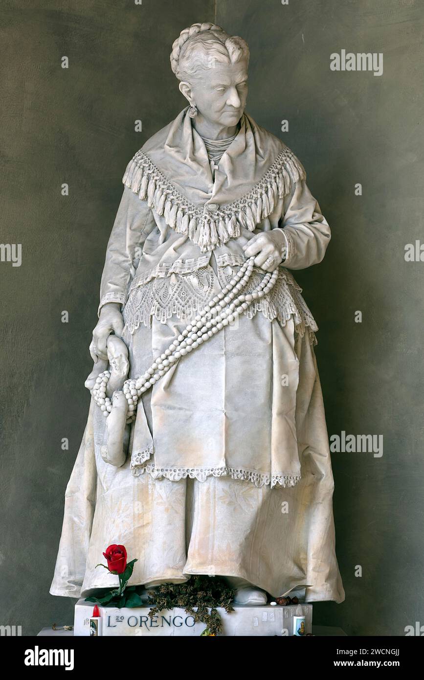 Marble sculpture of an old lady with a splendid robe, grave in the ...