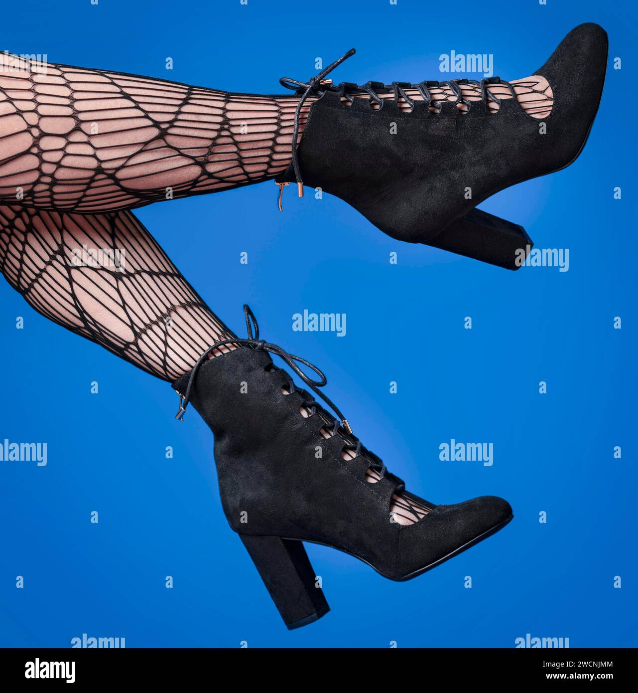 Legs in fishnet tights hi-res stock photography and images - Alamy