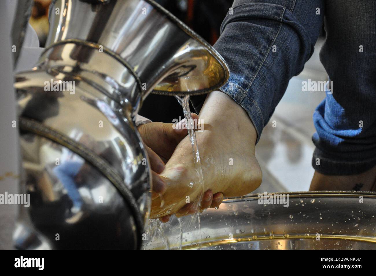 In the foot-washing ceremony, on Maundy Thursday, the Priest washes a ...