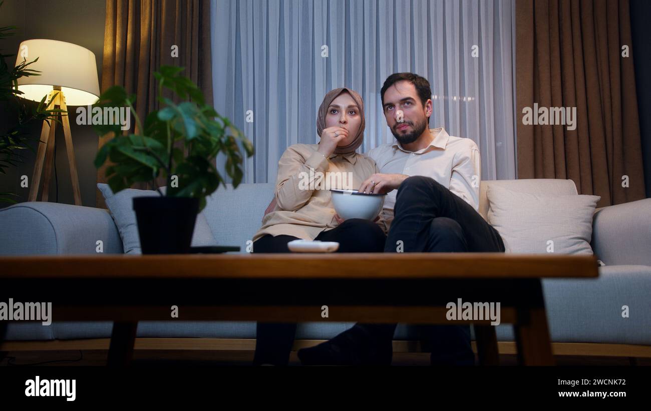 Young cozy couple watching tv, movies on subscription streaming service ...