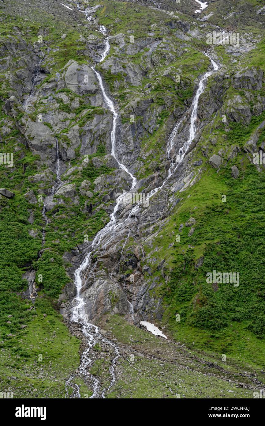 Mountain stream flowing down a steep rocky slope, Berliner Hoehenweg ...