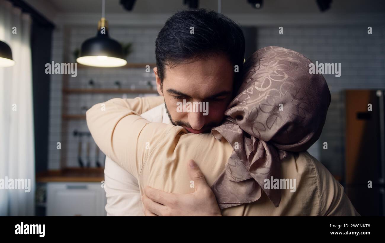 Rear view of woman hugging her husband. Romantic man hugging her. Close ...