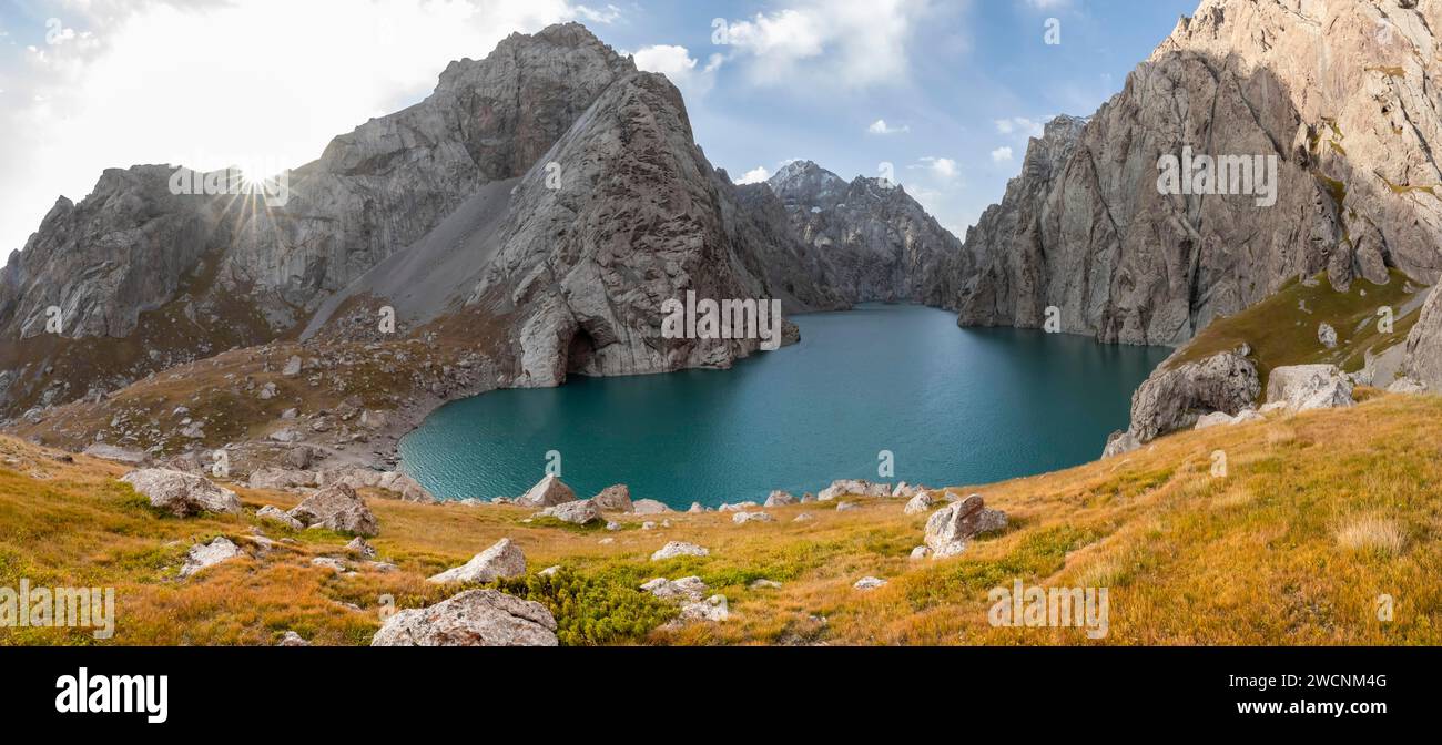 Mountain lake Kol Suu rocky steep mountains, sun star, Kol Suu Lake ...