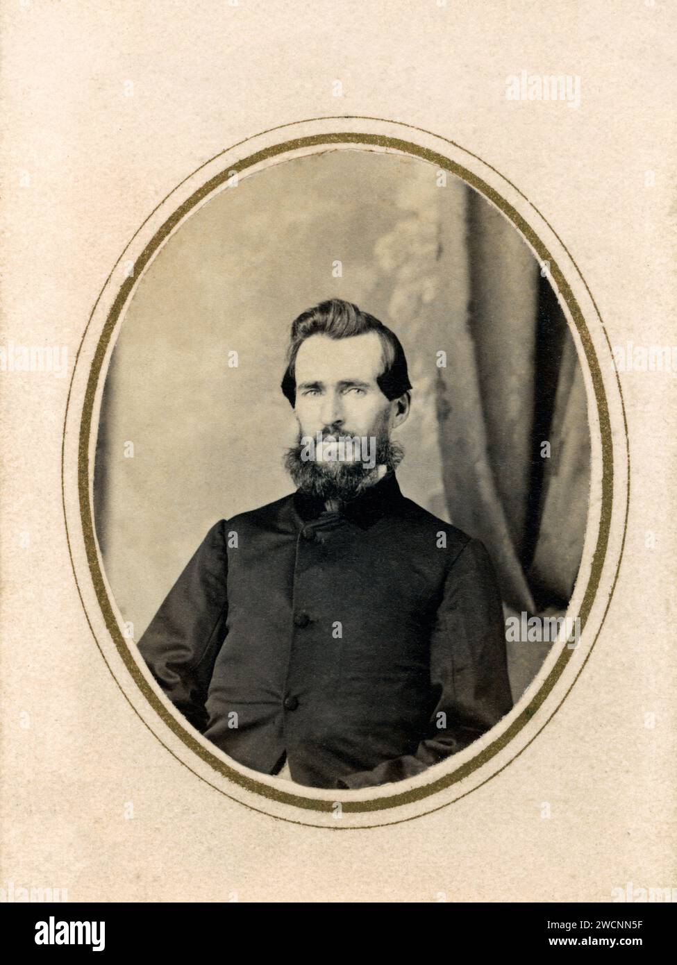 USA. 1800s. A man is looking into the camera while sitting down Stock ...