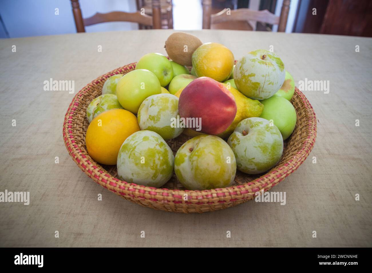 Basket plenty of seasonal fruit. Seasonal eating concept Stock Photo ...