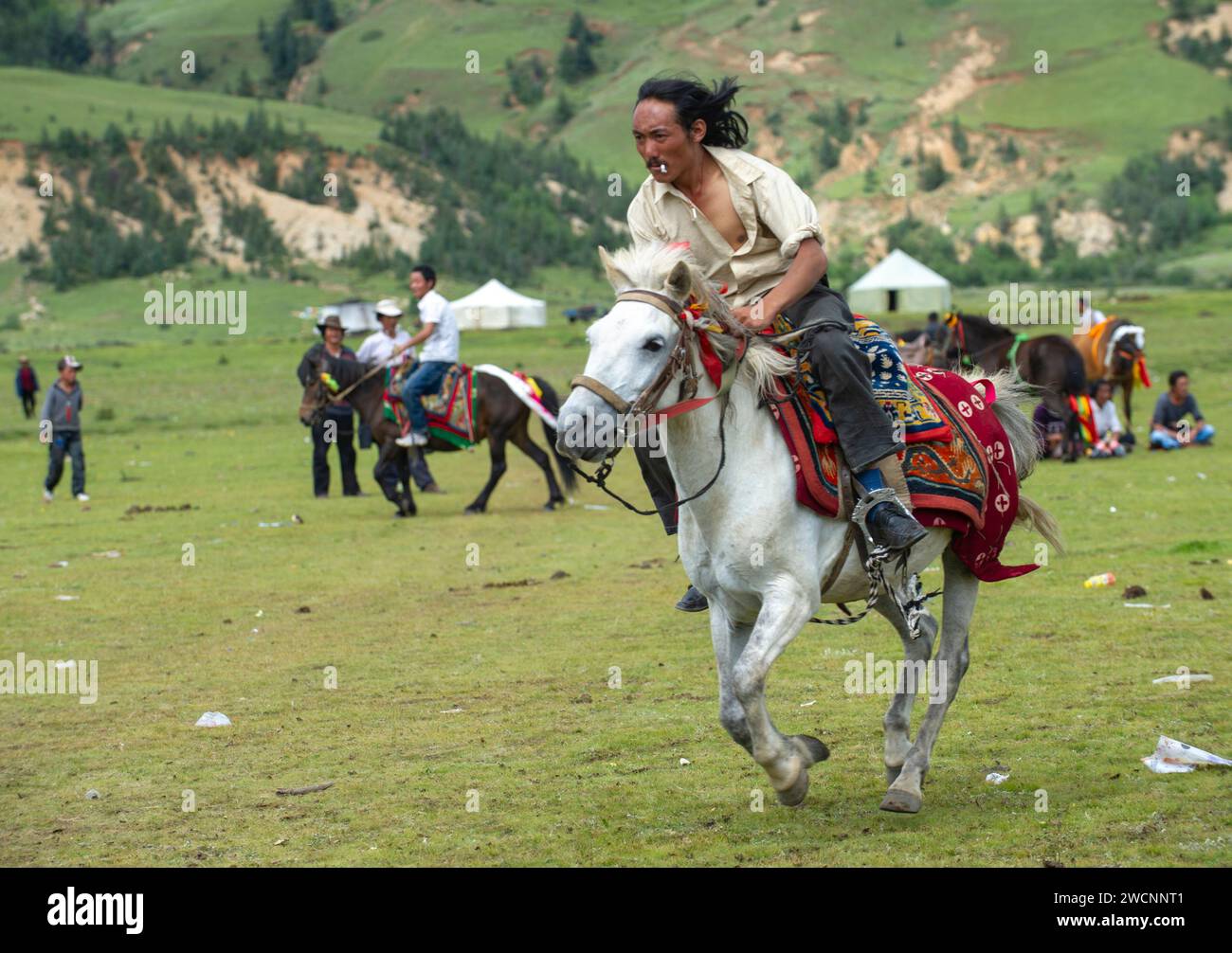 Tibet, Kham, Litang. Tibetan nomads at horse festival Stock Photo - Alamy