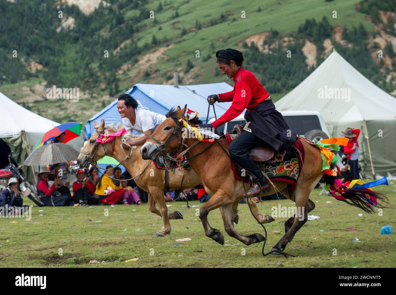 Tibet, Kham, Litang. Tibetan nomads at horse festival Stock Photo - Alamy