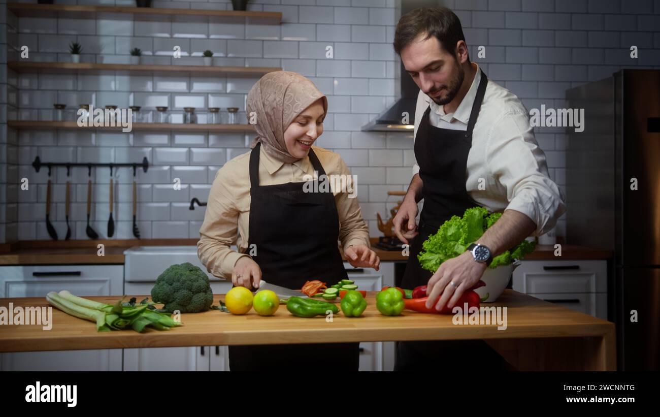 Young married couple enjoy conversation in the modern kitchen and ...