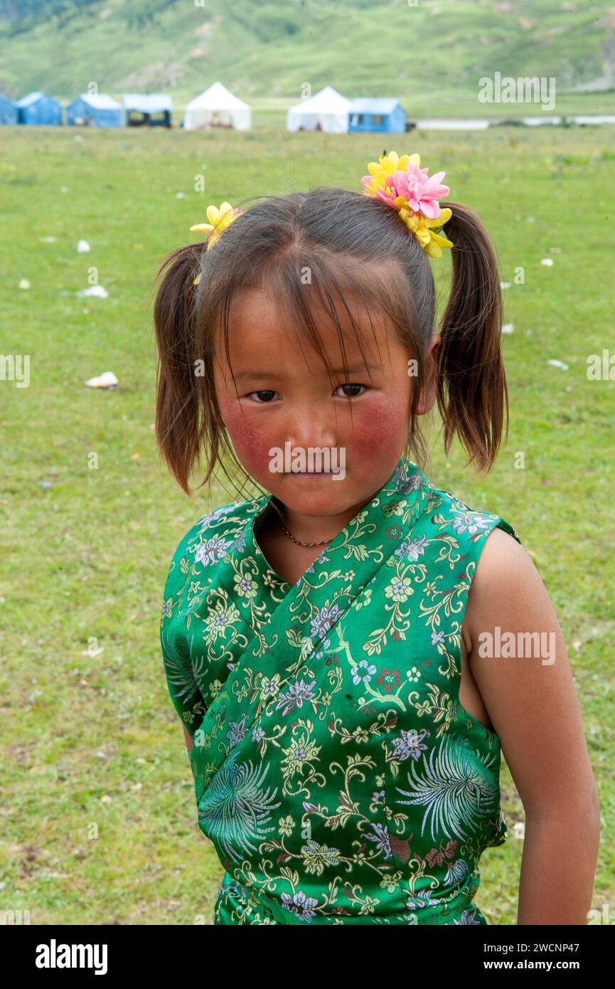 Tibet, Kham, Litang. A little girl at the traditional horse festival ...