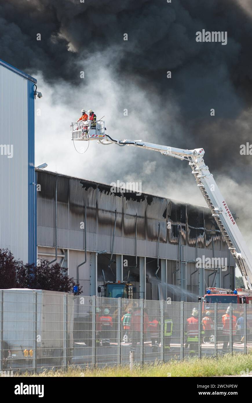Firefighters, two firefighters with protective clothing and gas masks ...
