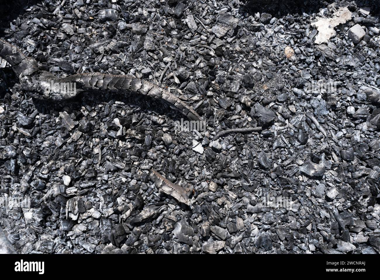 Looking down into charcoal in an outdoor fire pit Stock Photo - Alamy
