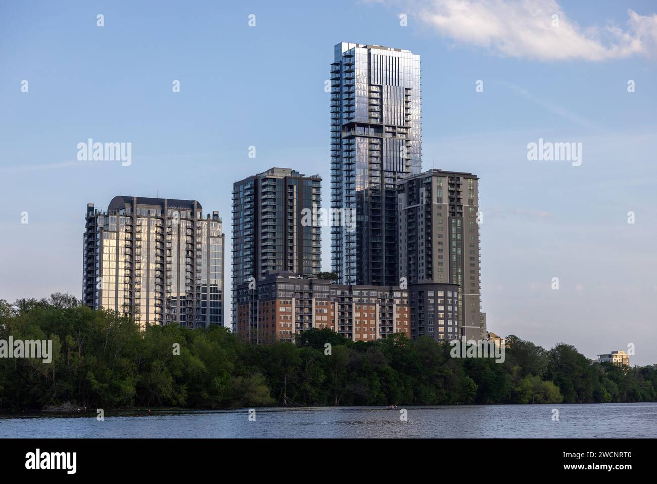 Row of several tall buildings in the distance behind the water and ...