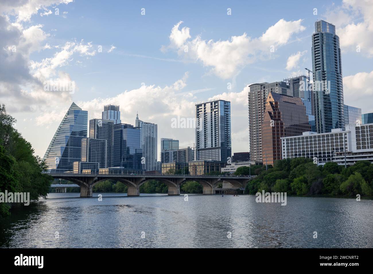 Row of several tall buildings in the distance behind the water and ...