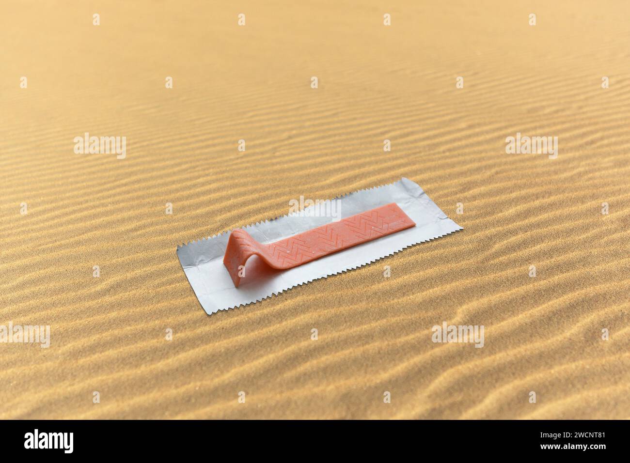 Symbolic image of chewing gum on the beach and lying on a towel Stock ...