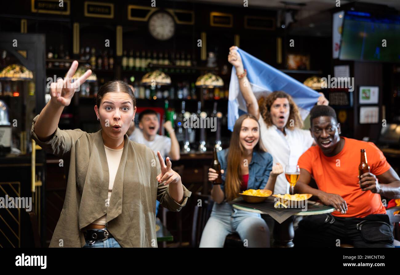 Happy girl emotionally cheering for favorite team of Argentina in ...