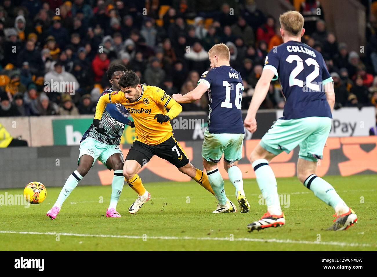 Brentford's Michael Olakigbe (left) and Ben Mee combine to tackle ...