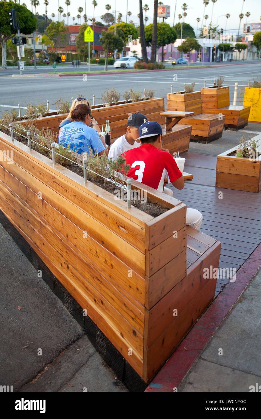 Convert on street parking spaces hi-res stock photography and images - Alamy