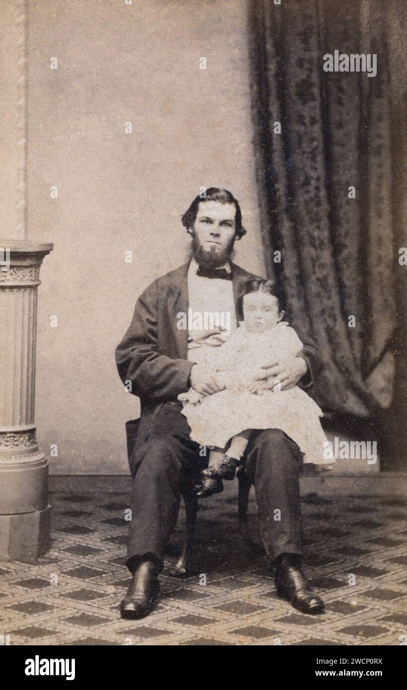 A studio portrait of a father with his child Stock Photo - Alamy
