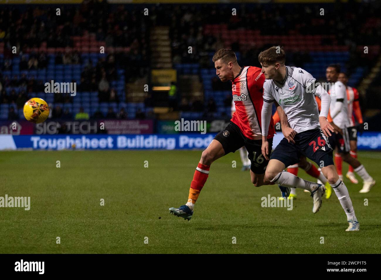 Zac Ashworth #26 of Bolton Wanderers tackles Reece Burke #16 of Luton ...