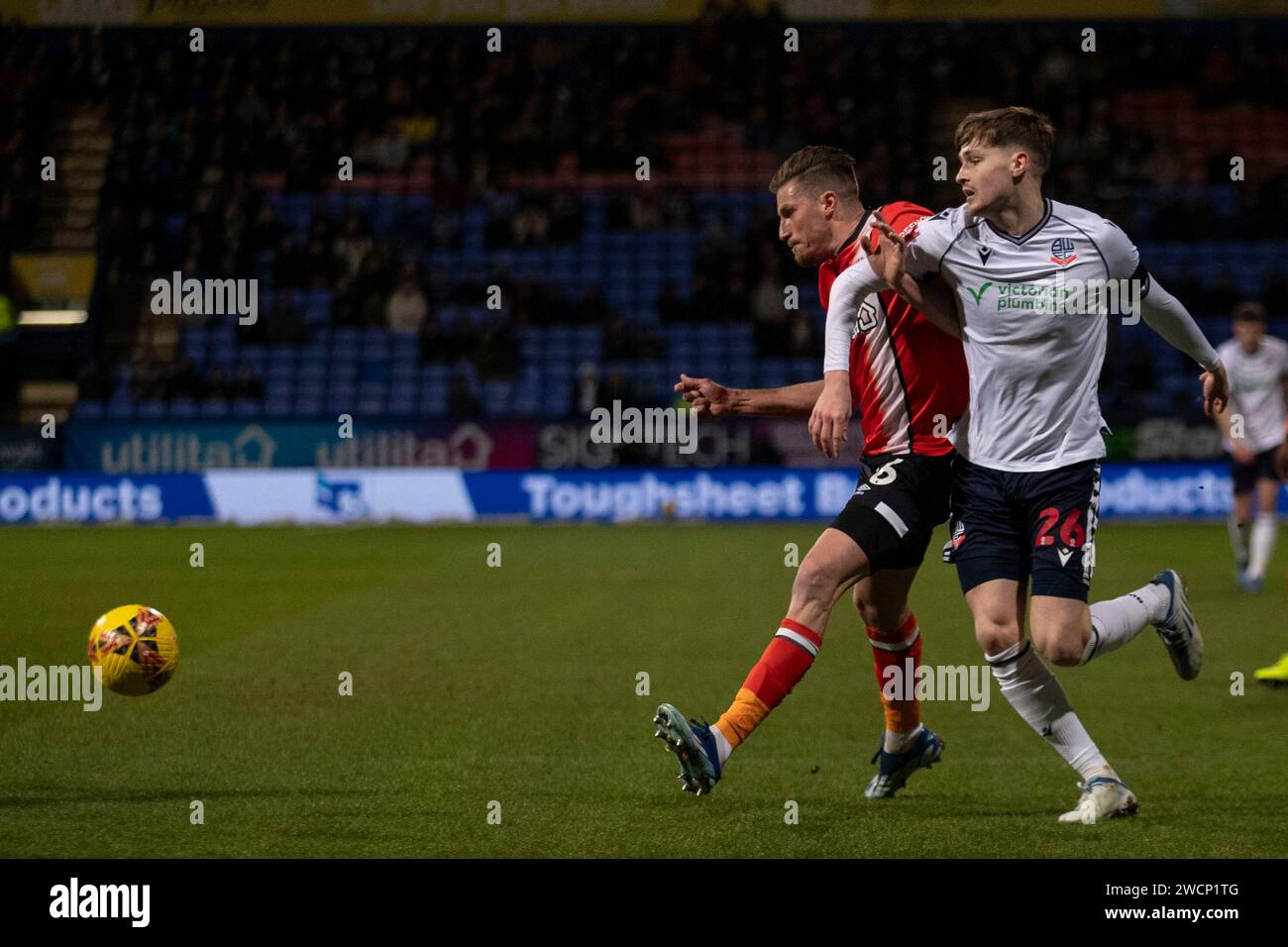 Zac Ashworth #26 of Bolton Wanderers tackles Reece Burke #16 of Luton ...