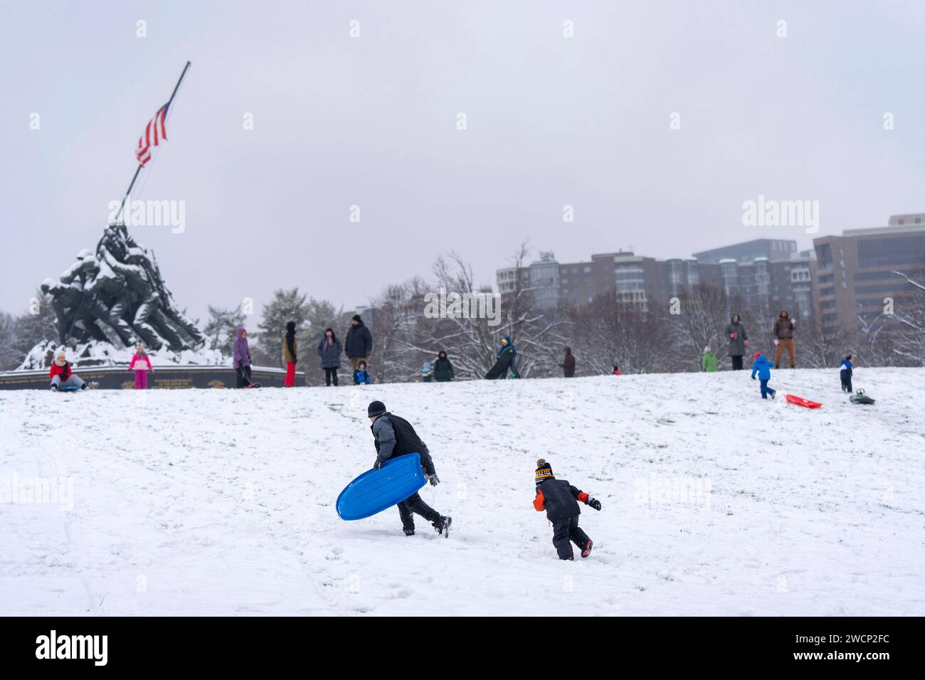 Arlington, United States. 16th Jan, 2024. Children sled down a hill ...
