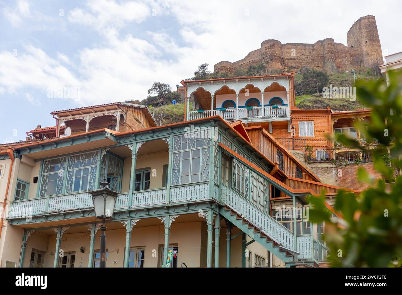 Traditional Georgian houses in Tbilisi at foot of Narikala fortress ...