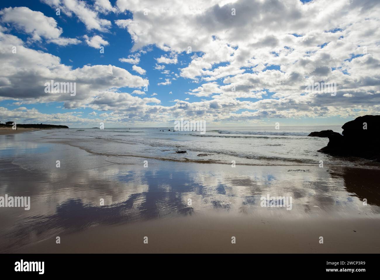 Clouds reflections on beach Stock Photo - Alamy