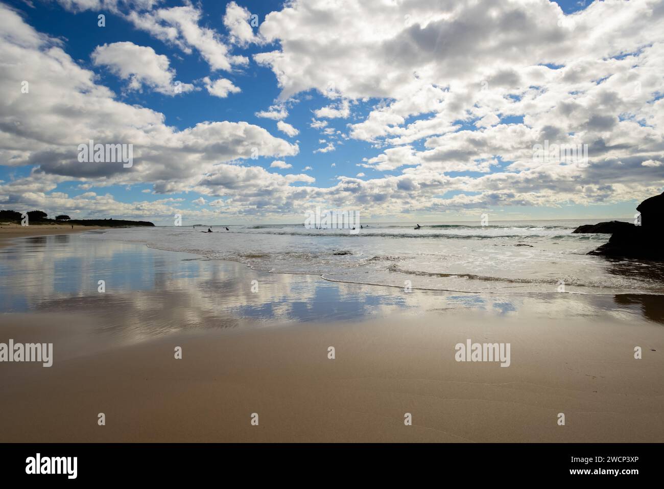 Clouds reflections on beach Stock Photo - Alamy