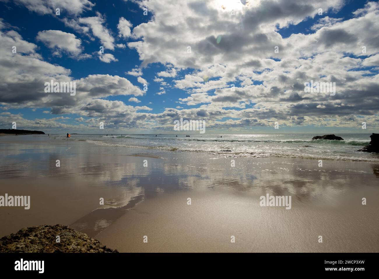 Clouds reflections on beach Stock Photo - Alamy