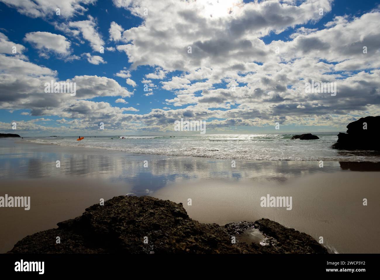 Clouds reflections on beach Stock Photo - Alamy