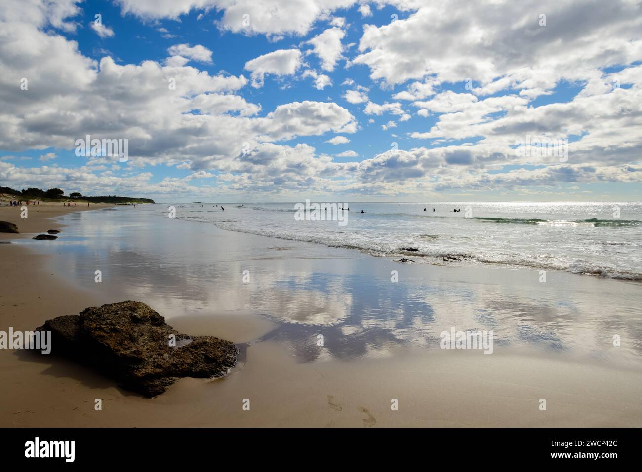 Clouds reflections on beach Stock Photo - Alamy