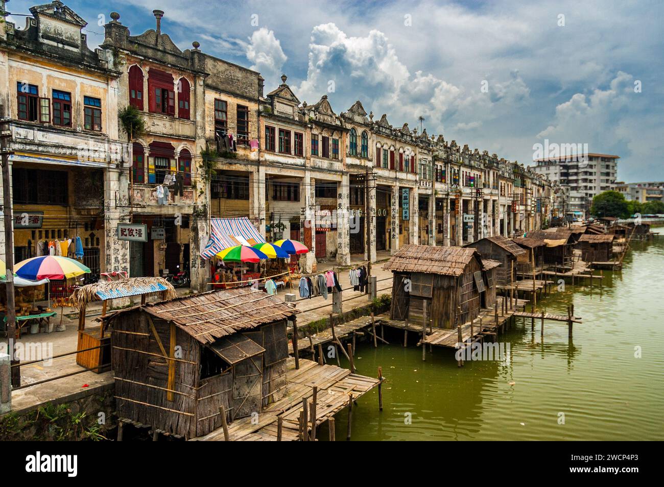 Traditional qilou buildings, which house both shops and homes line the ...