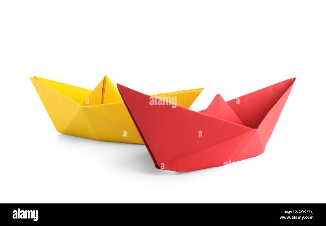Colorful origami boats on white background Stock Photo - Alamy