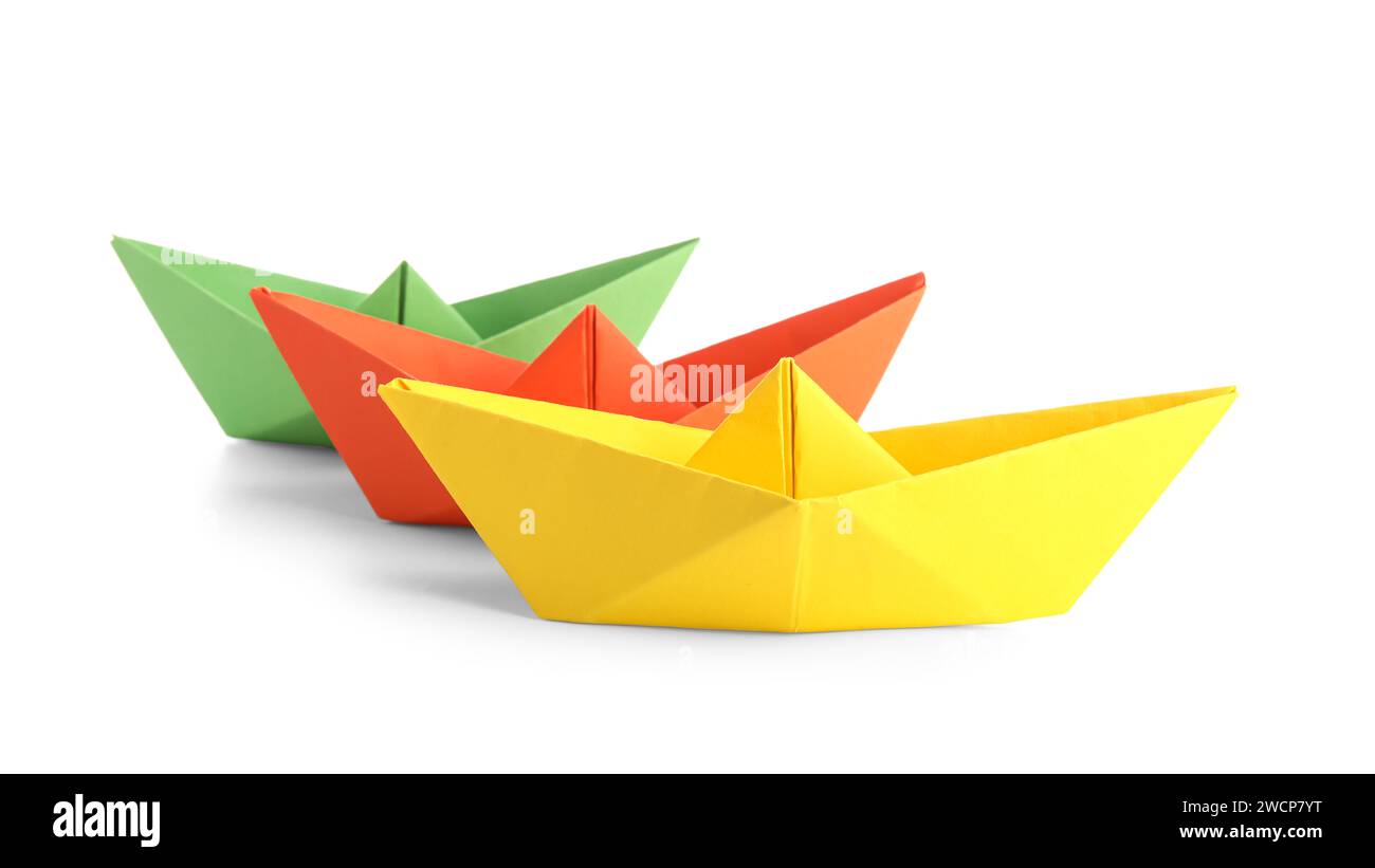Colorful origami boats on white background Stock Photo - Alamy