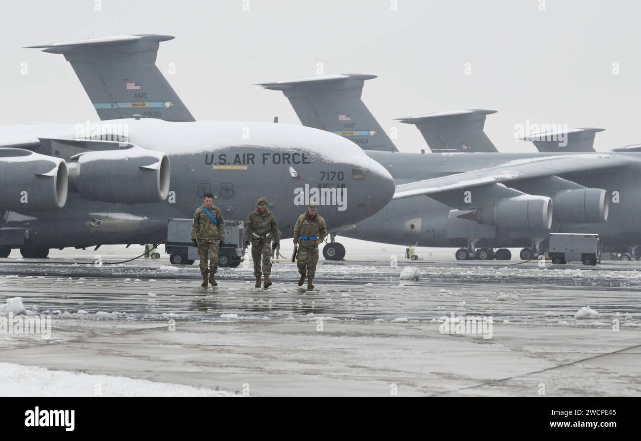 Maintainers from Dover Air Force Base, Delaware, walk across the ...