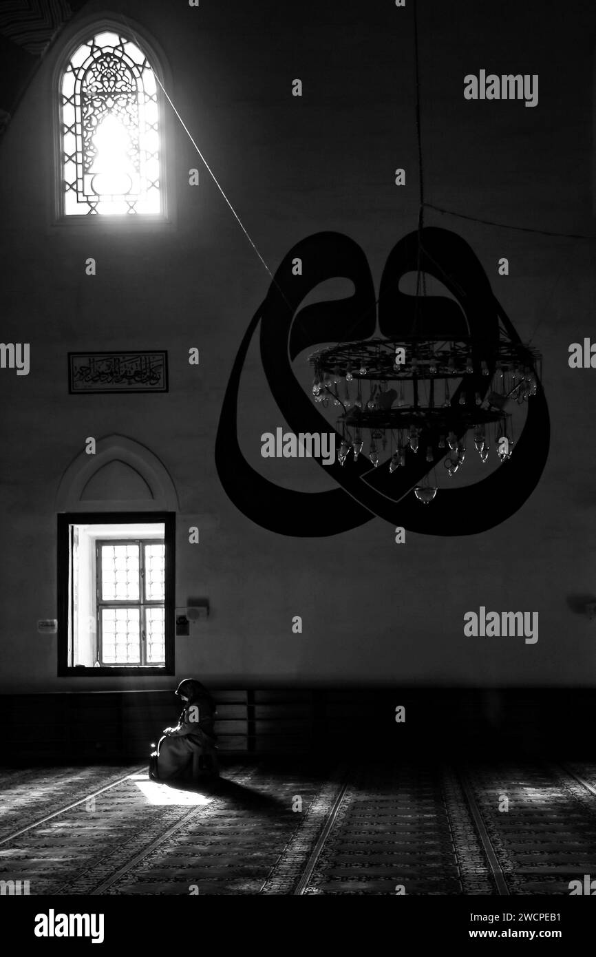 Edirne, Turkiye - January 14, 2024: Lady praying inside Eski Cami, the ...