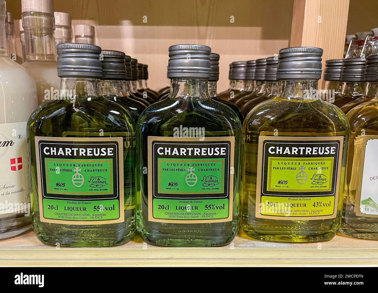 Small flask shaped bottles of Chartreuse liqueur for sale Stock Photo ...