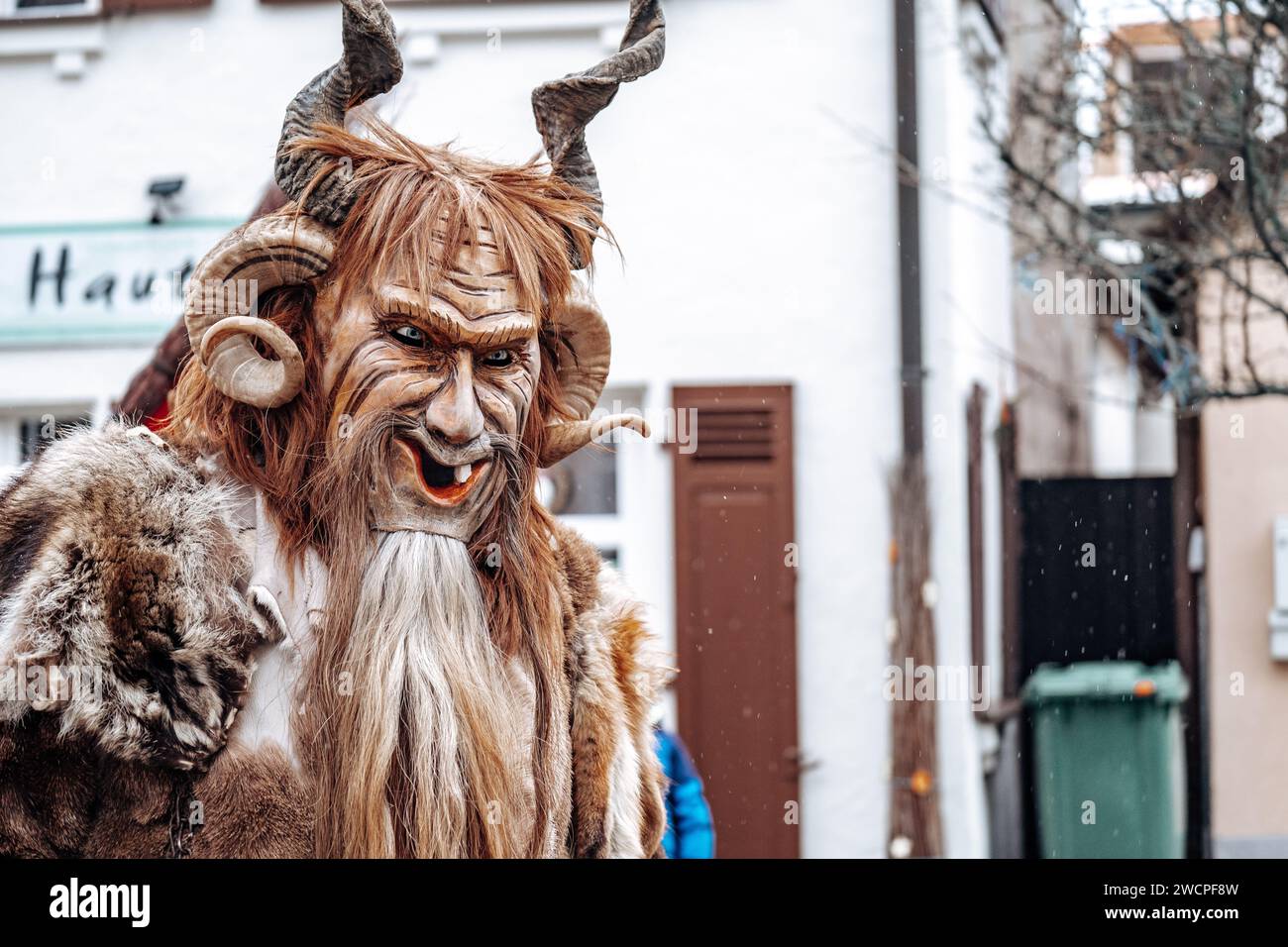 Krampus monster costumes on street background.Carnival processions in ...