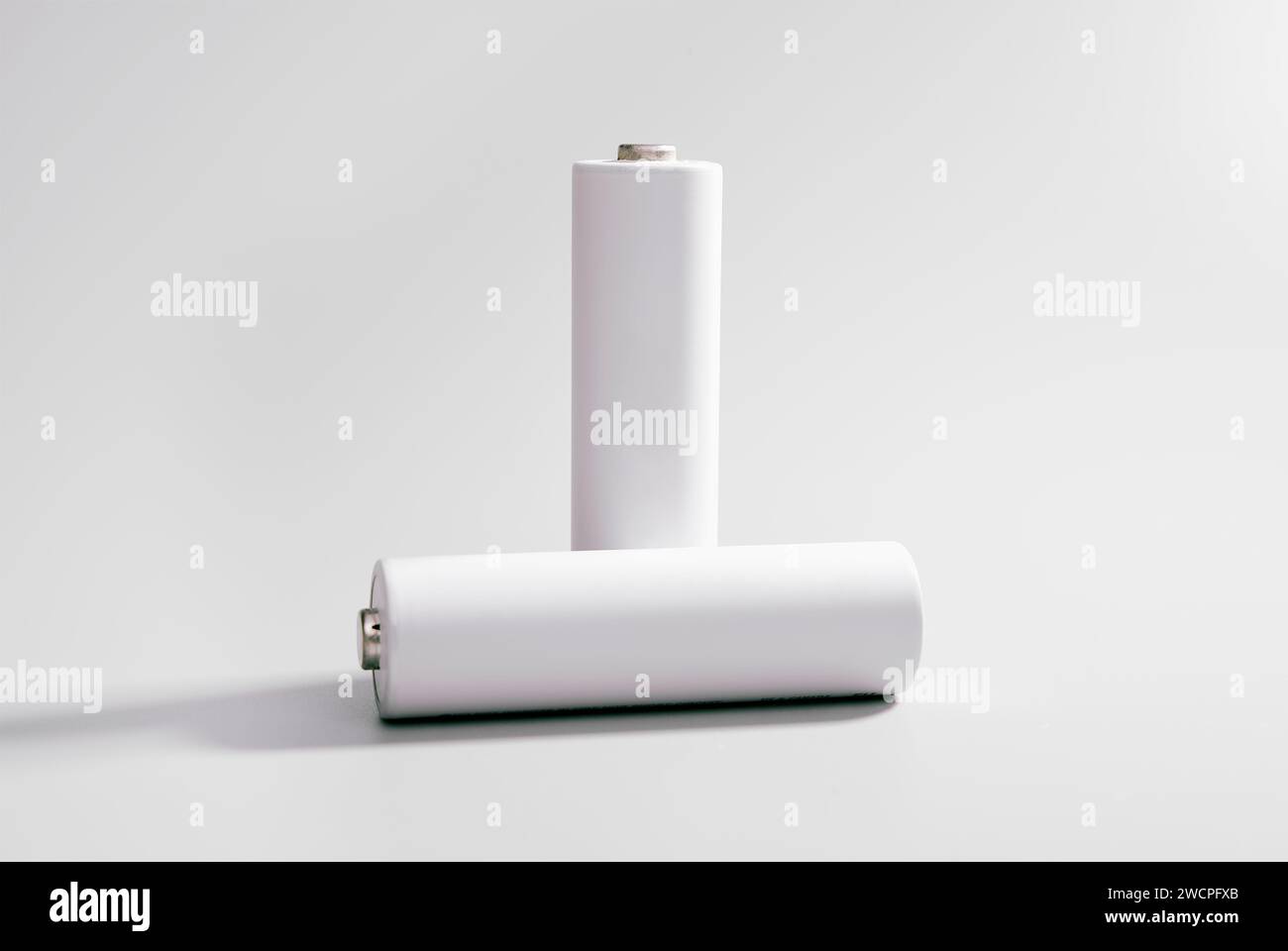 Two AA-sized white rechargeable 1.2V batteries Stock Photo - Alamy