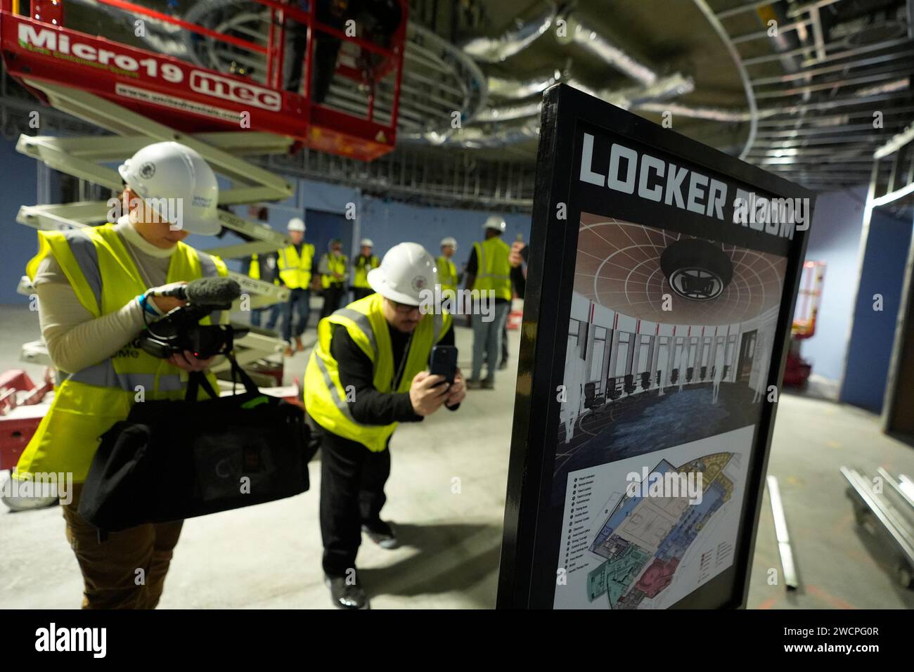 Members of the media tour the future locker room at the Intuit Dome in ...