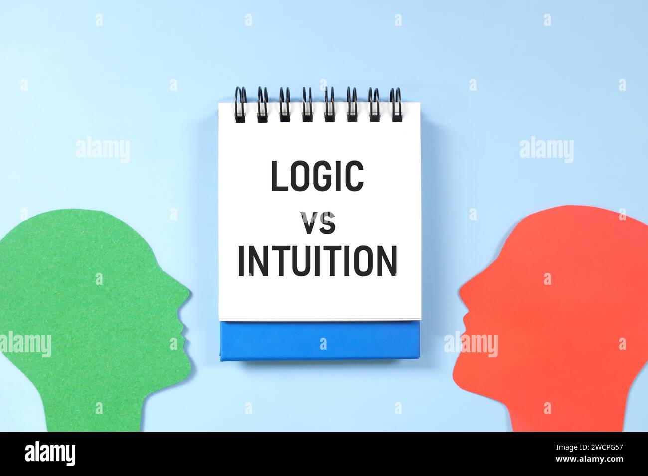 Logic versus intuition concept. Human head profile in blue background ...
