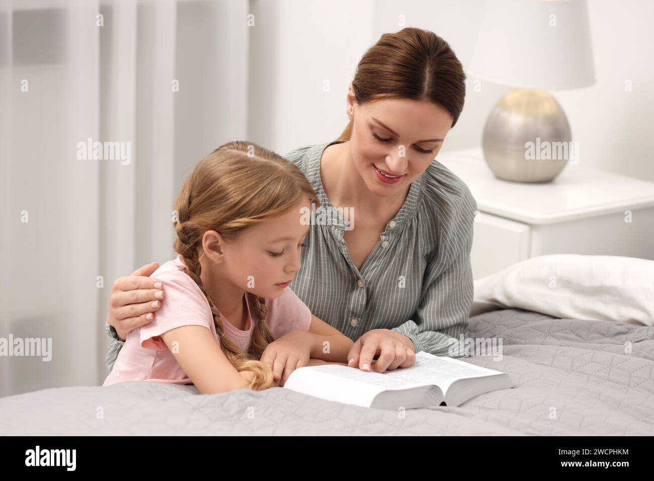 Girl reading holy bible home hi-res stock photography and images - Alamy