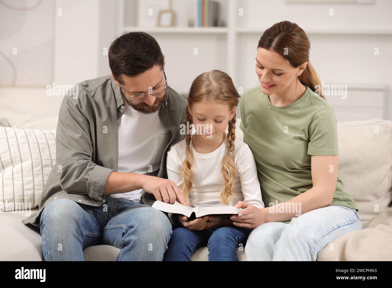 Girl reading holy bible home hi-res stock photography and images - Alamy